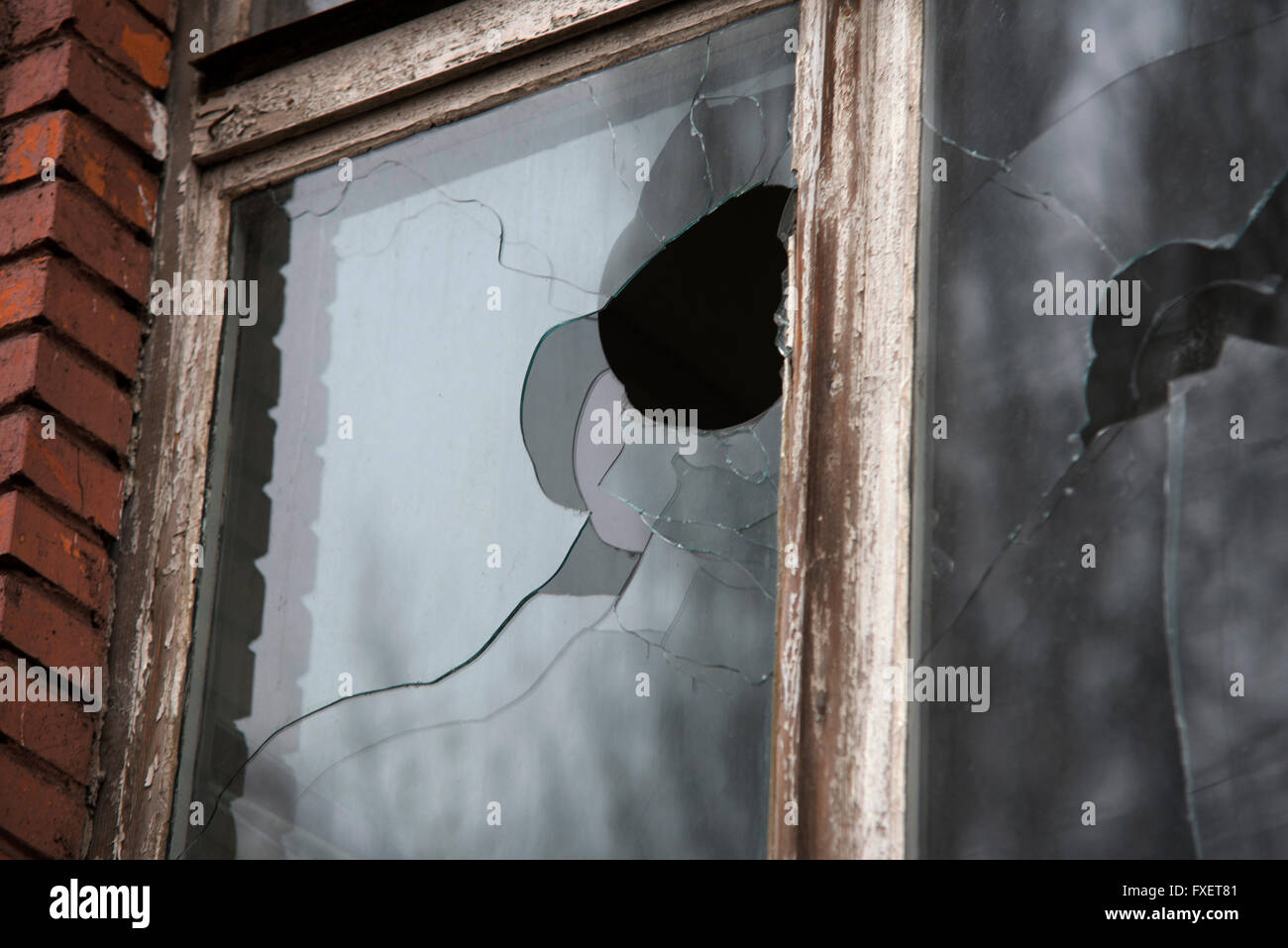 broken glass window reflecting clounding sky Stock Photo - Alamy