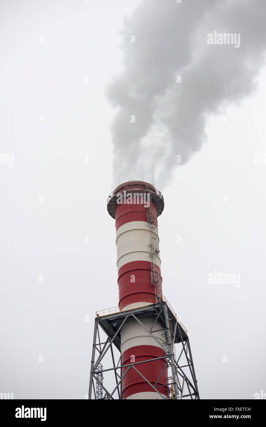 Chimneys with dramatic clouds of smoke Stock Photo - Alamy