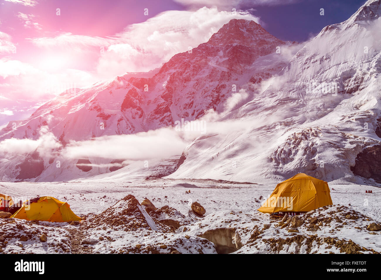 High Altitude Mountains and Orange Tents Stock Photo - Alamy