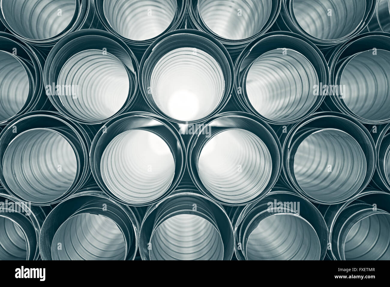 Metallic Pipes stacked in rows pattern Stock Photo - Alamy
