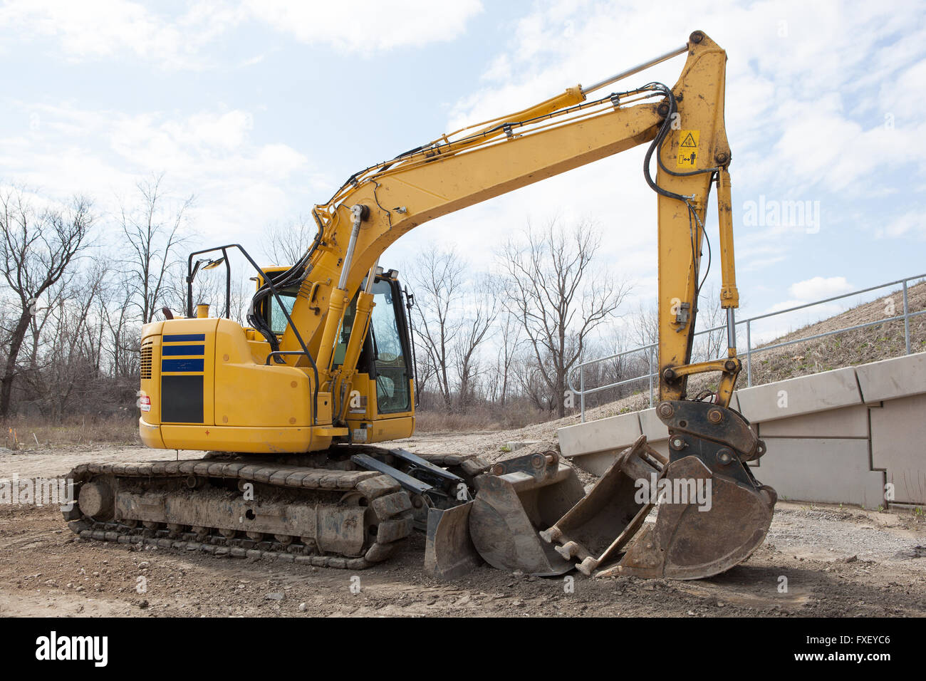 Parked Backhoe At Construction Site Stock Photo - Alamy