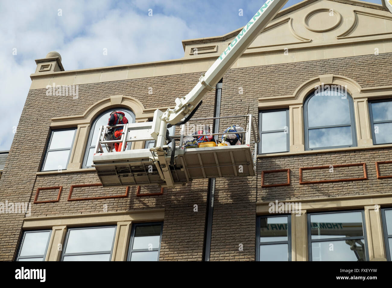 Building Maintenance from a Crane Platform -1 Stock Photo - Alamy
