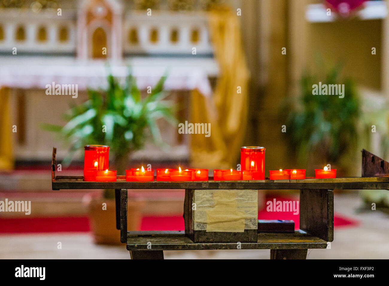 red candles in Catholics church Stock Photo - Alamy
