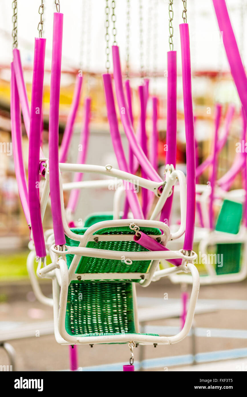 Closeup of carousel seats Stock Photo - Alamy
