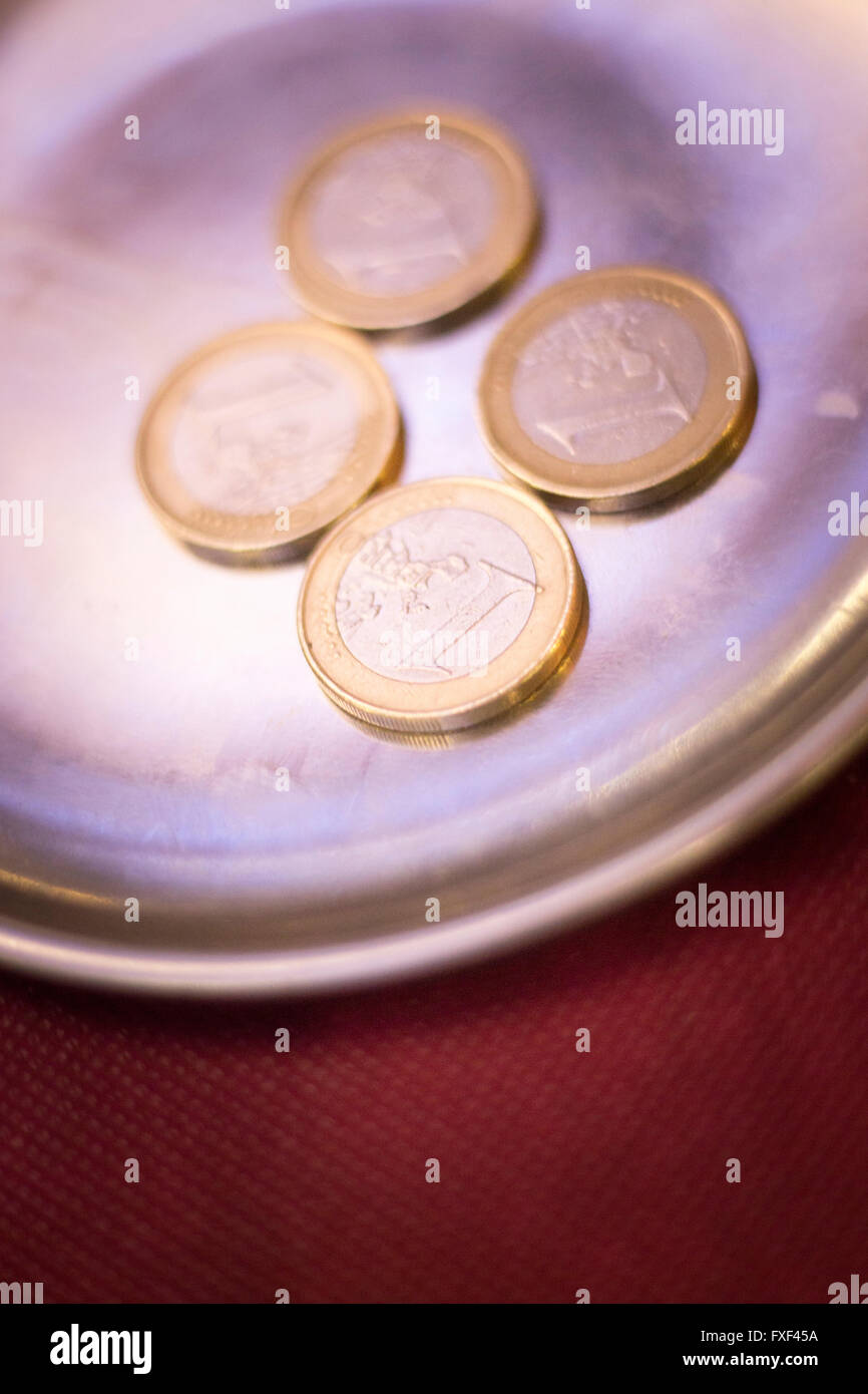 Euros coins change money in restaurant on metal tray paying meal check ...