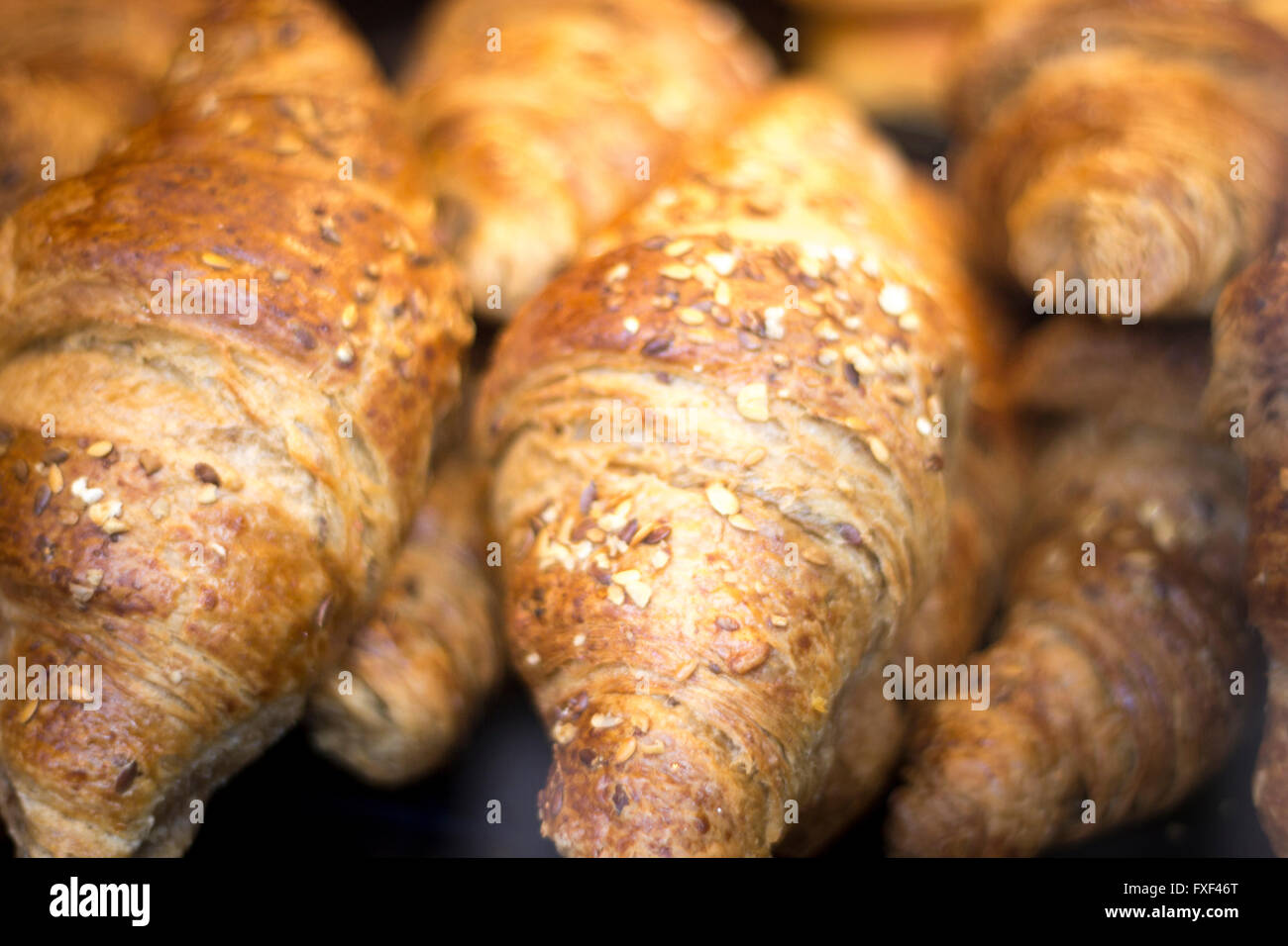Croissants in bread shops store display photo Stock Photo - Alamy