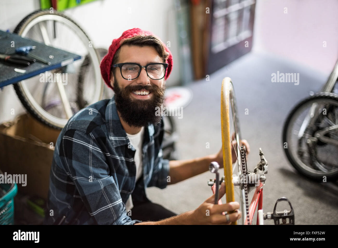 Bike mechanic checking at bicycle Stock Photo - Alamy