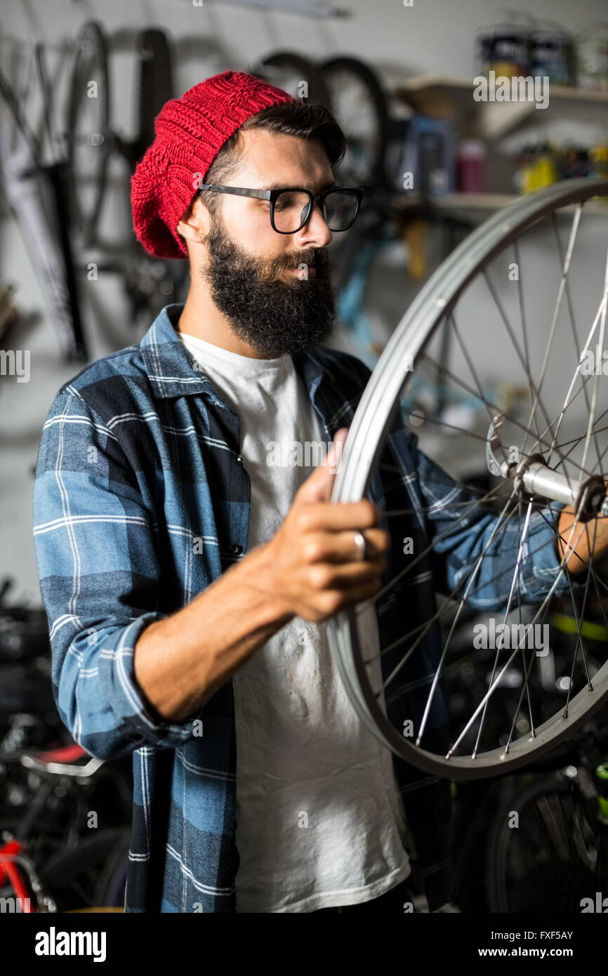 Man repairing bicycle home checking hi-res stock photography and images ...