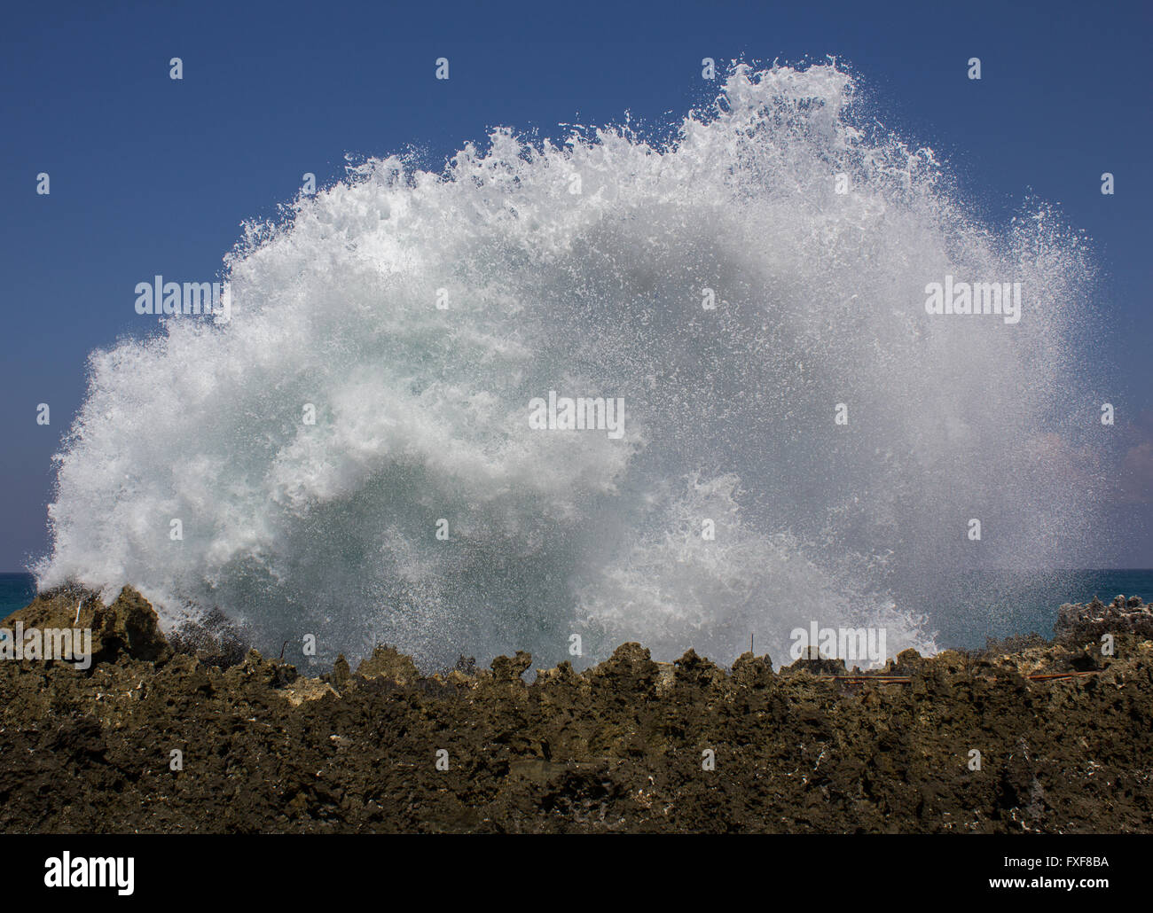 Waves crash against a break wall hi-res stock photography and images ...