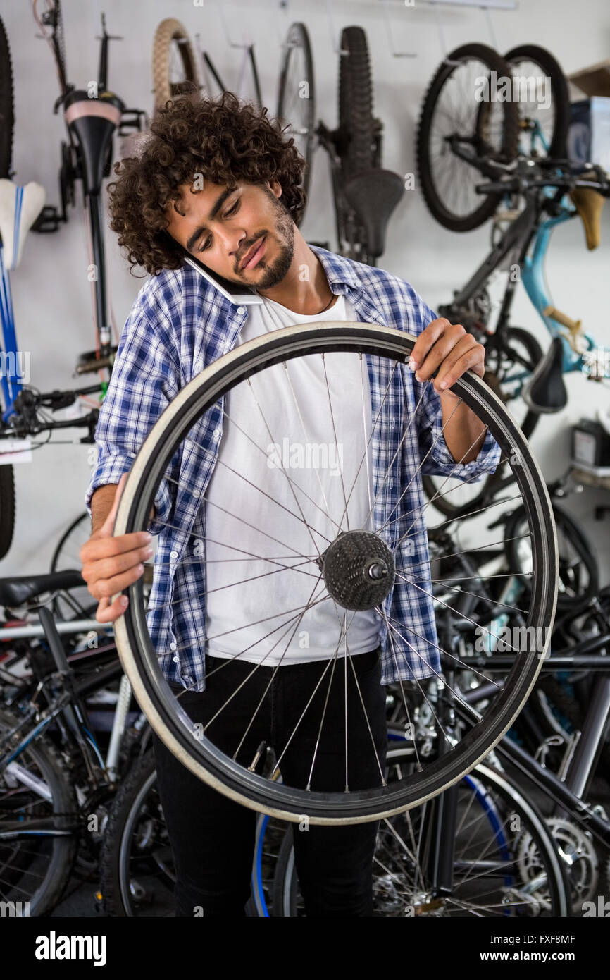 Worker using phone repairing hi-res stock photography and images - Alamy