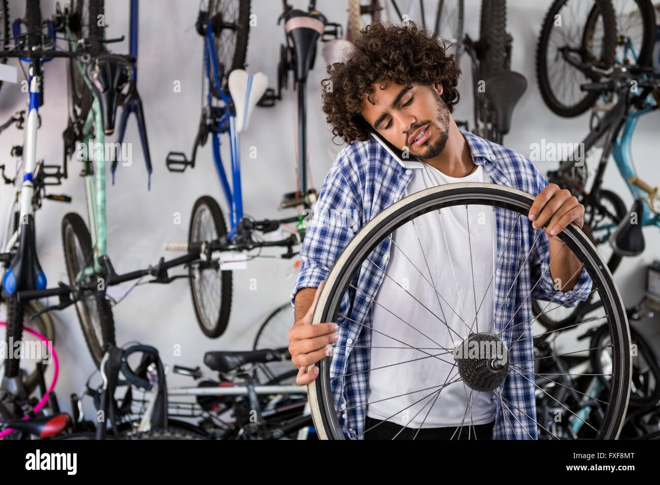 Worker using phone repairing hi-res stock photography and images - Alamy