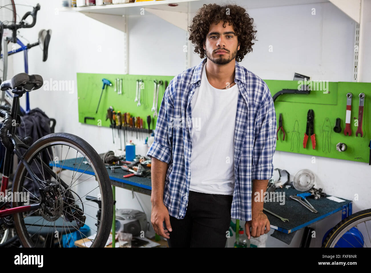 Serious worker standing Stock Photo - Alamy