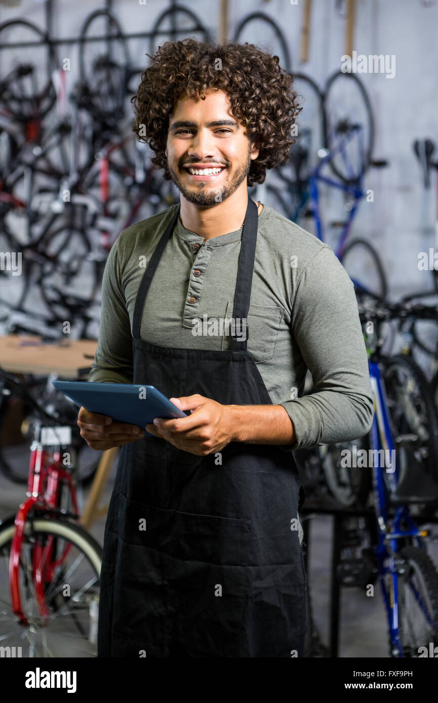 Smiling worker using tablet Stock Photo - Alamy