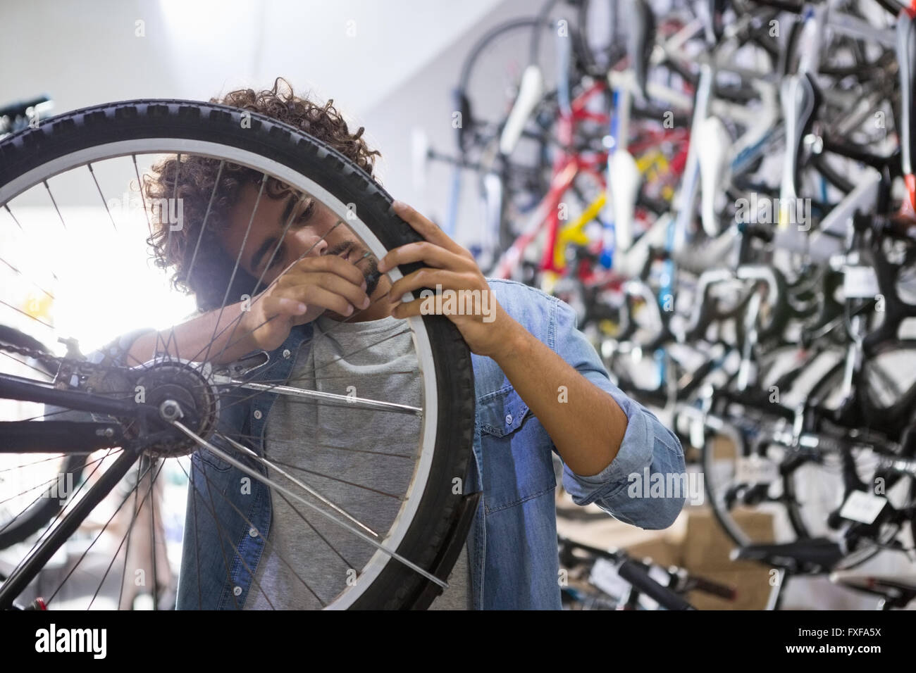 Worker repairing bicycles Stock Photo - Alamy