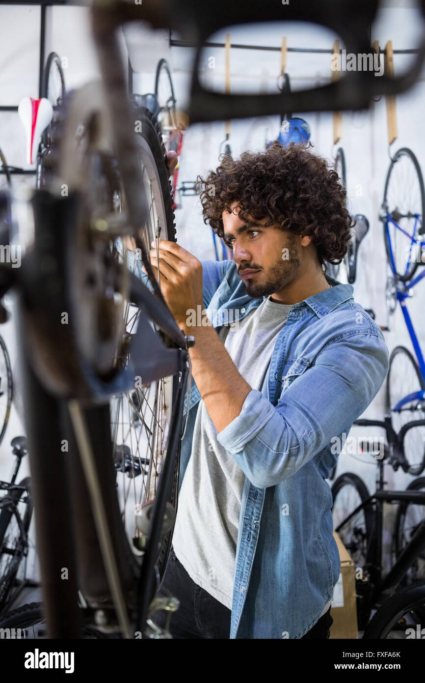 Worker repairing bicycles Stock Photo - Alamy