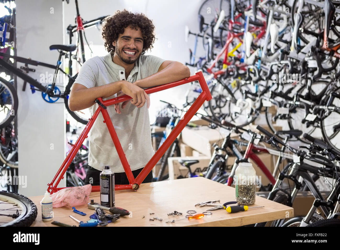 Worker repairing bicycles Stock Photo - Alamy