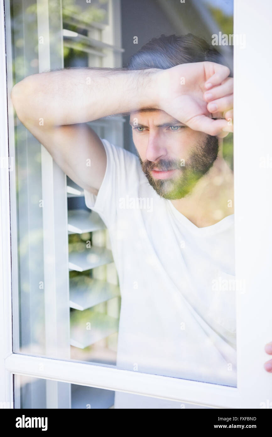 Man leaning on window hi-res stock photography and images - Alamy