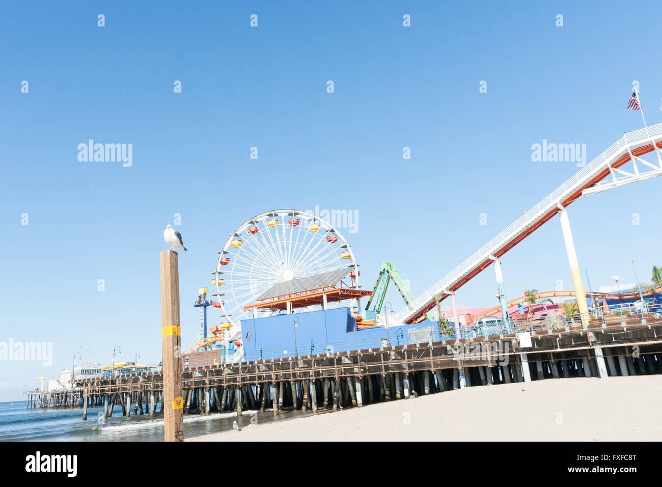 Santa Monica Pier rides and attractions with waterslide Stock Photo - Alamy