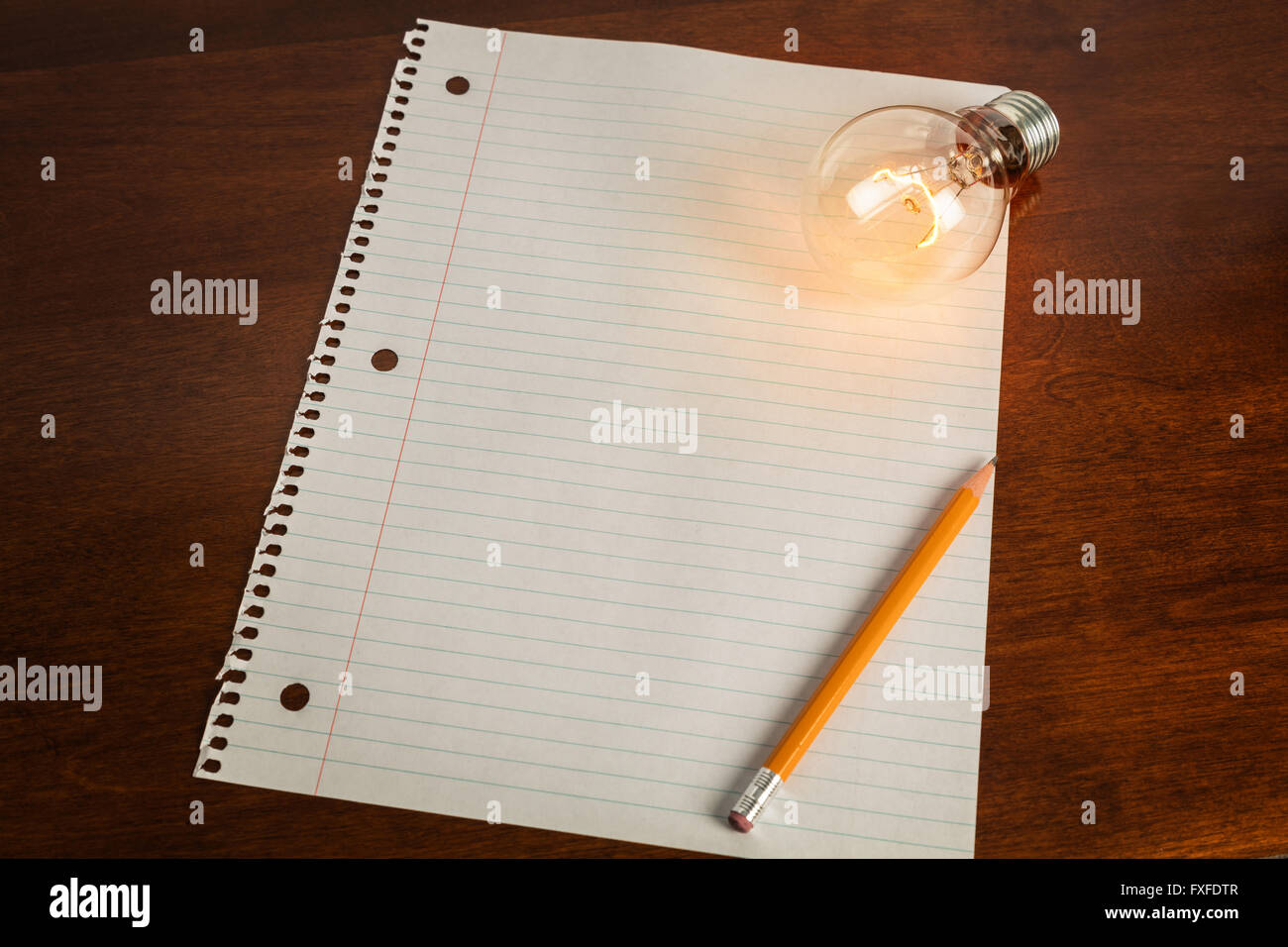 notebook paper and light bulb, business education concept Stock Photo ...