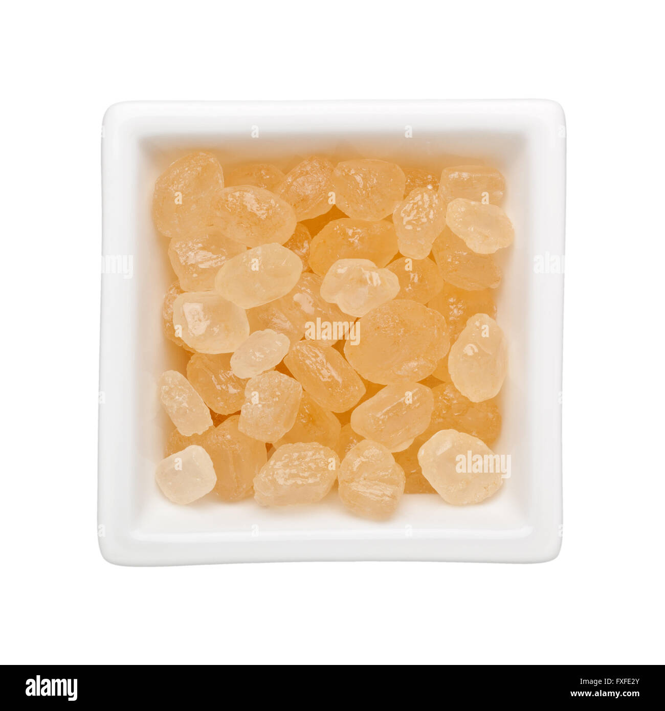 Brown rock sugar in a square bowl isolated on white background Stock ...