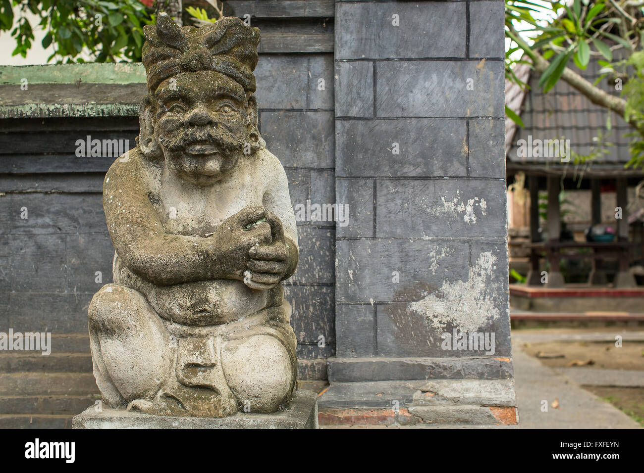 Traditional guard statue carved in stone on Bali island, Indonesia ...