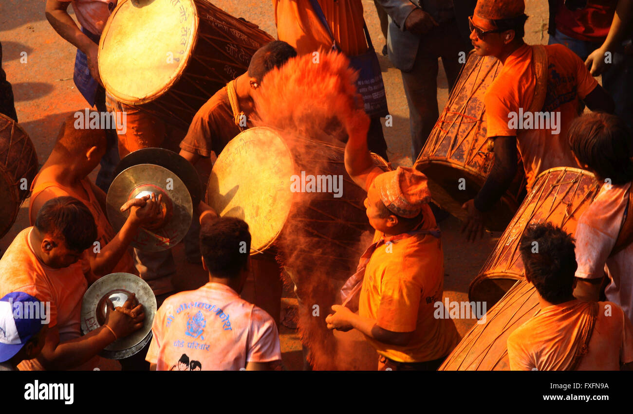 Bhaktapur, Nepal. 14th Apr, 2016. People throw vermilion powder each ...