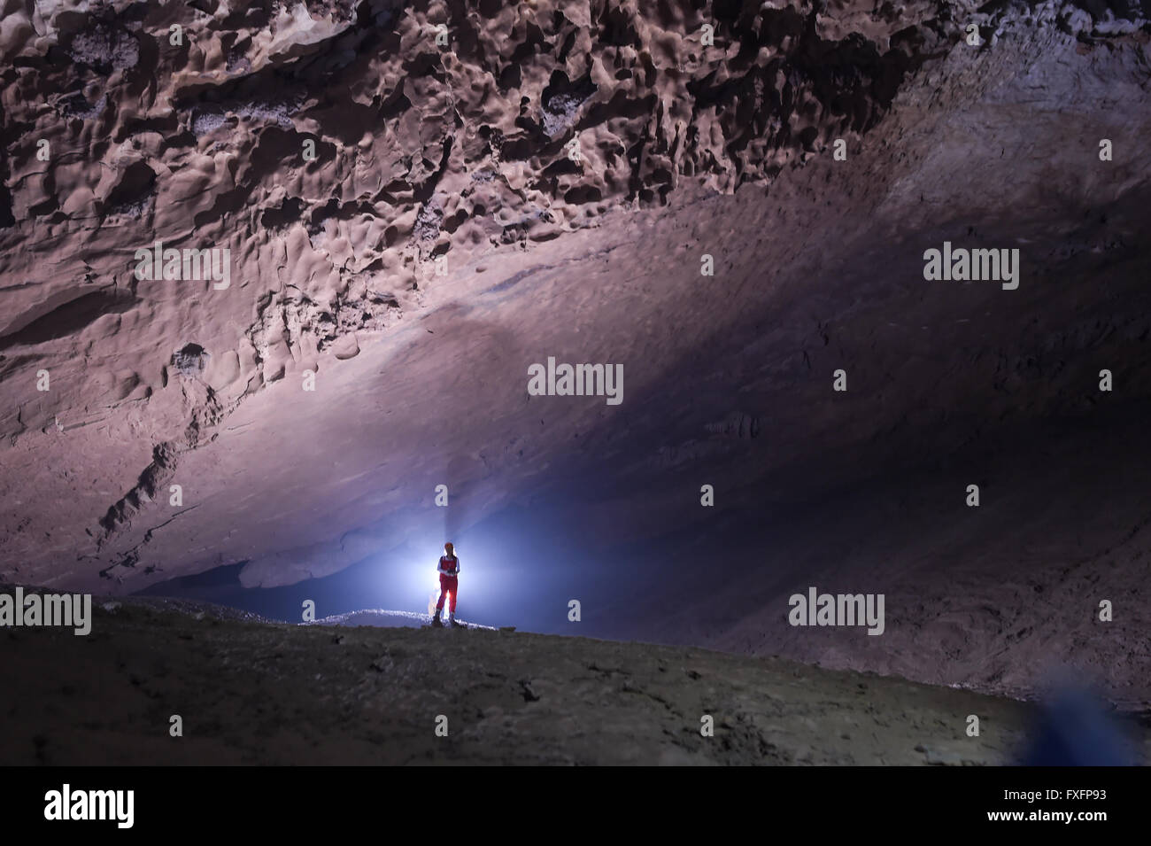 Ziyun, China. 15th April, 2016. An expedition member works within the ...