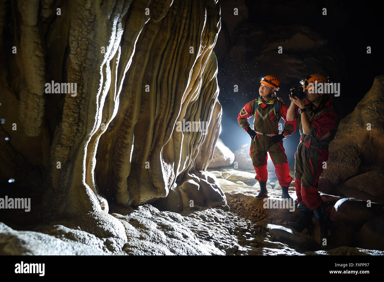 Ziyun, China. 15th April, 2016. Expedition members take picture of ...