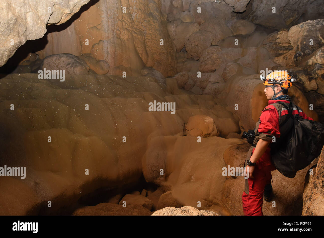 Ziyun, China. 15th April, 2016. An expedition member looks at ...
