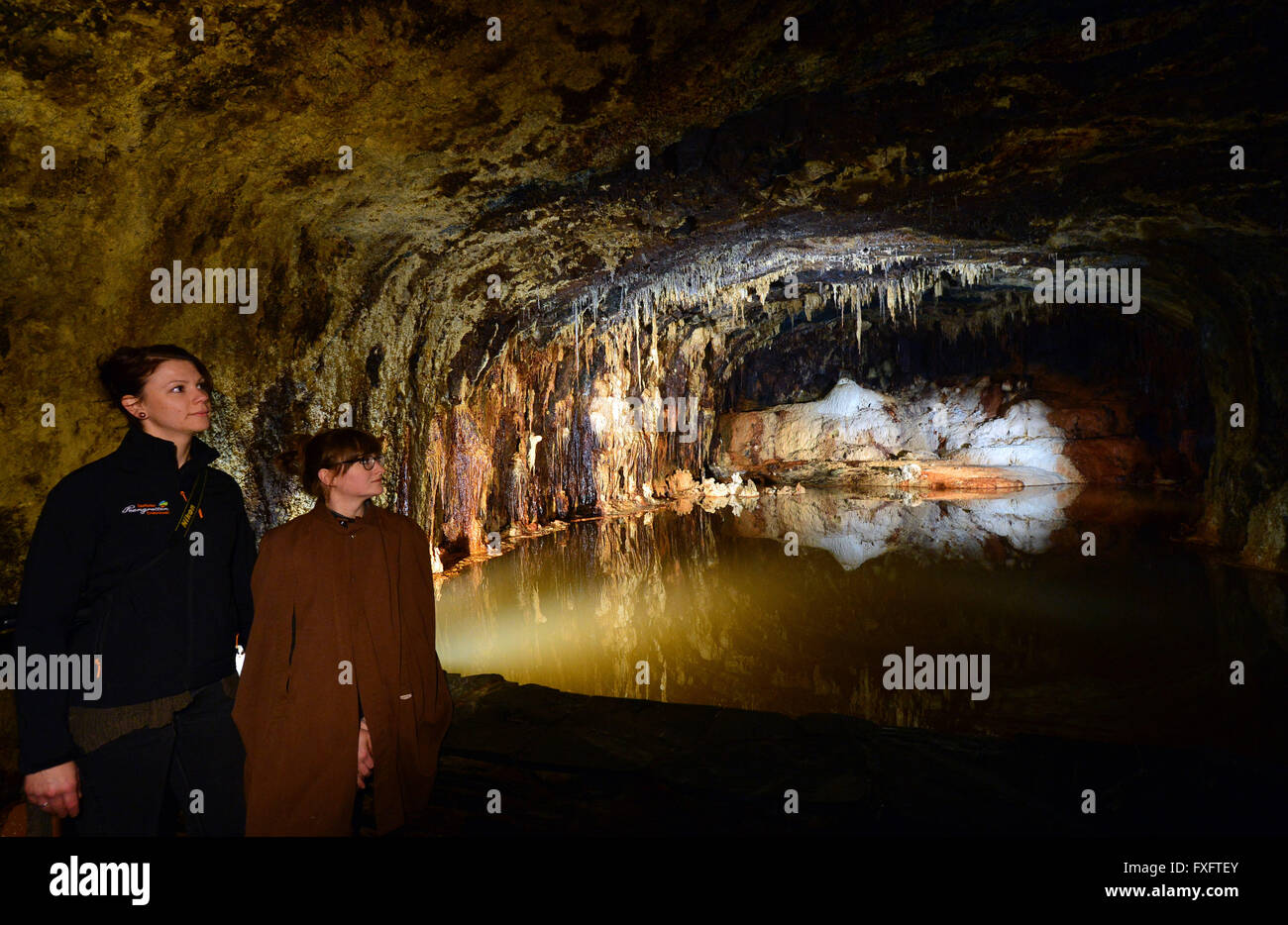 Two visitors walk through the grotto attraction at the 'Feengrotten ...