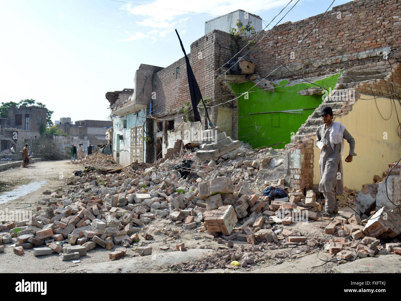 Debris lying next to the structures pulled down partially by the ...