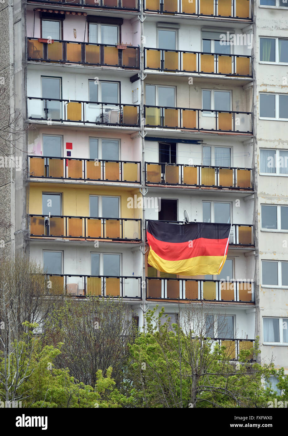 Halle, Germany. 14th Apr, 2016. A German flag hanging off a balcony of ...