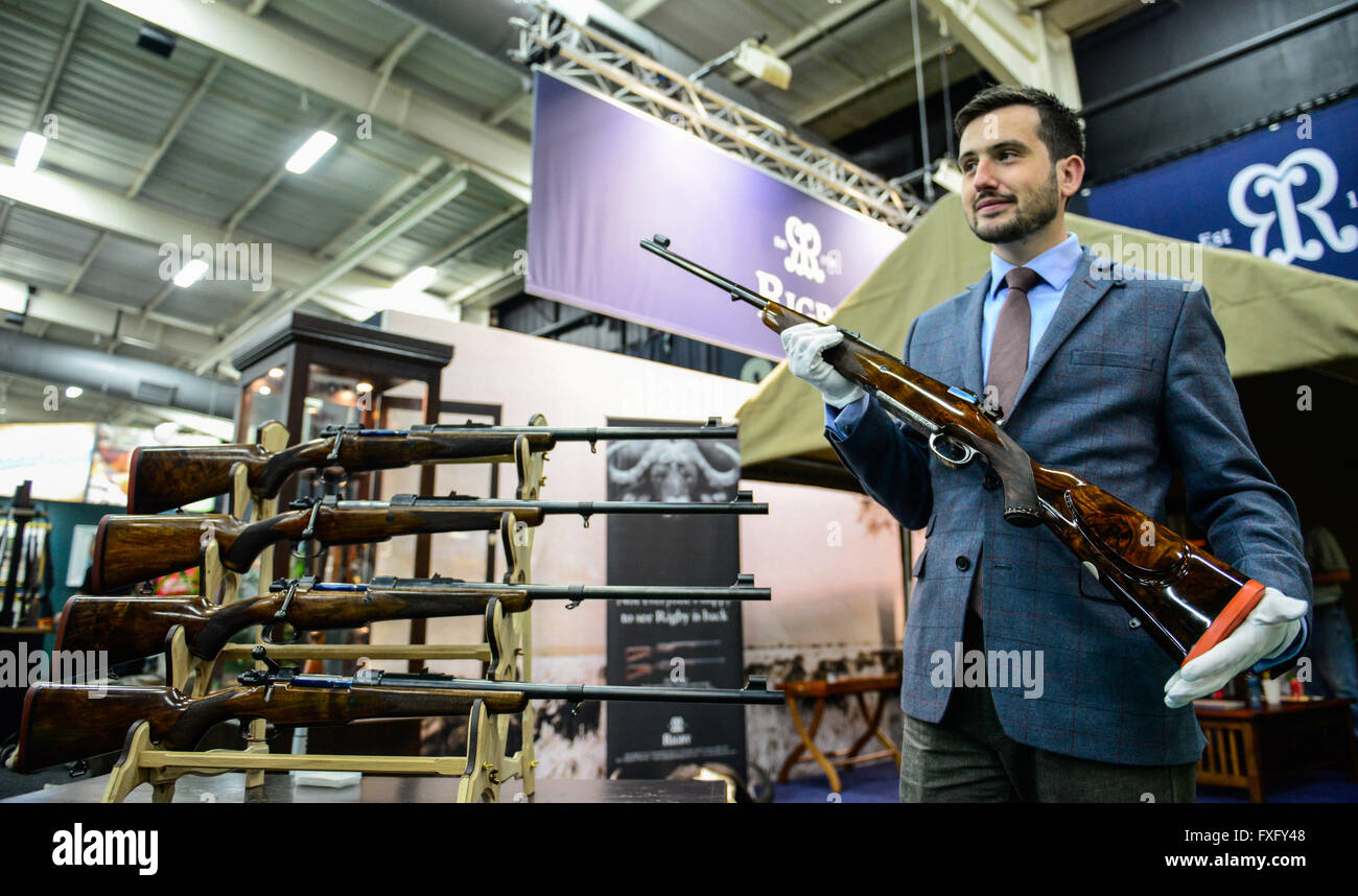 Midrand, South Africa. 15th Apr, 2016. A seller holds a rifle named ...