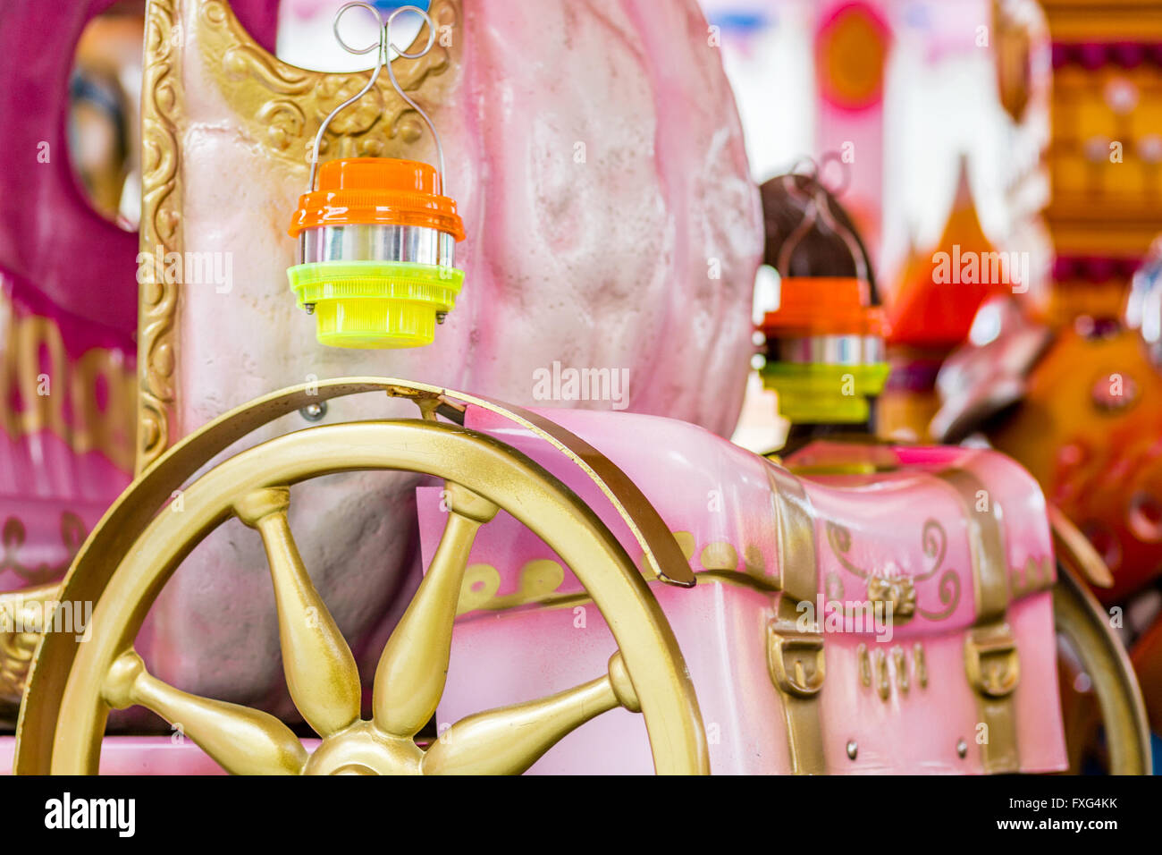 close up of merry-go-round seats, fairy carriage Stock Photo - Alamy