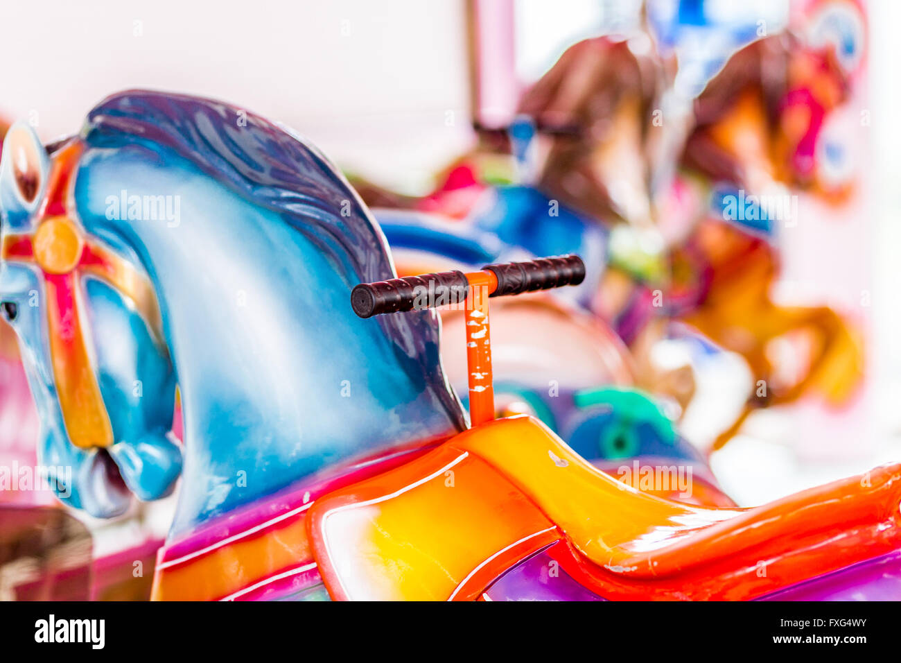 close up of merry-go-round seats, galloping horses Stock Photo - Alamy