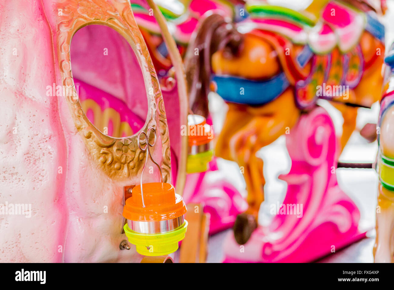 close up of merry-go-round seats, fairy carriage Stock Photo - Alamy