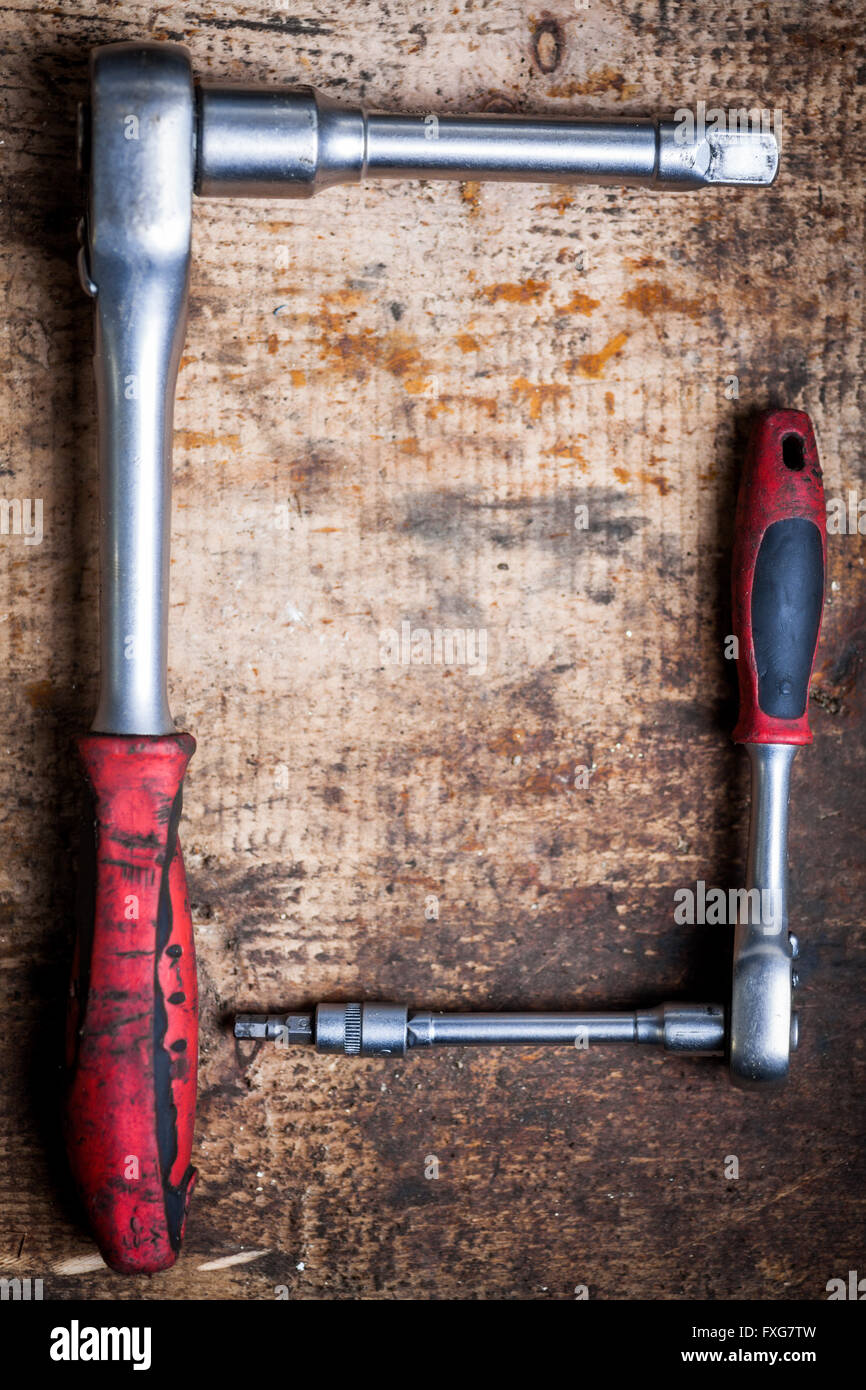 Color image of two socket spanners on a wooden plank Stock Photo - Alamy