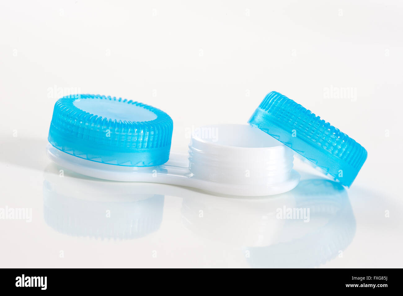 Blue plastic contacts case on the white background Stock Photo - Alamy