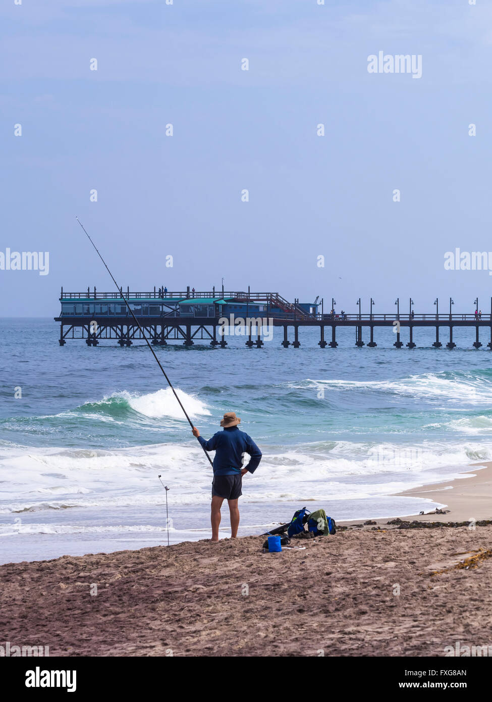 Fisherman angler fishing on beach hi-res stock photography and images ...