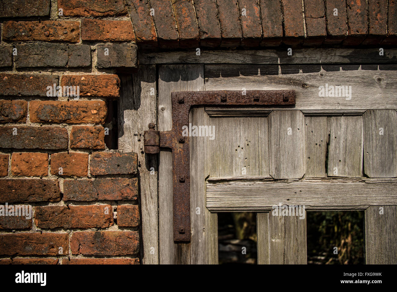 Broken door with missing panels, rusty hinge, old brickwork Stock Photo ...