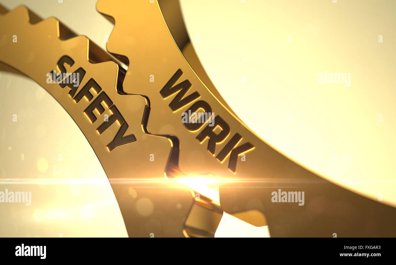 Work Safety on Golden Cogwheels Stock Photo - Alamy