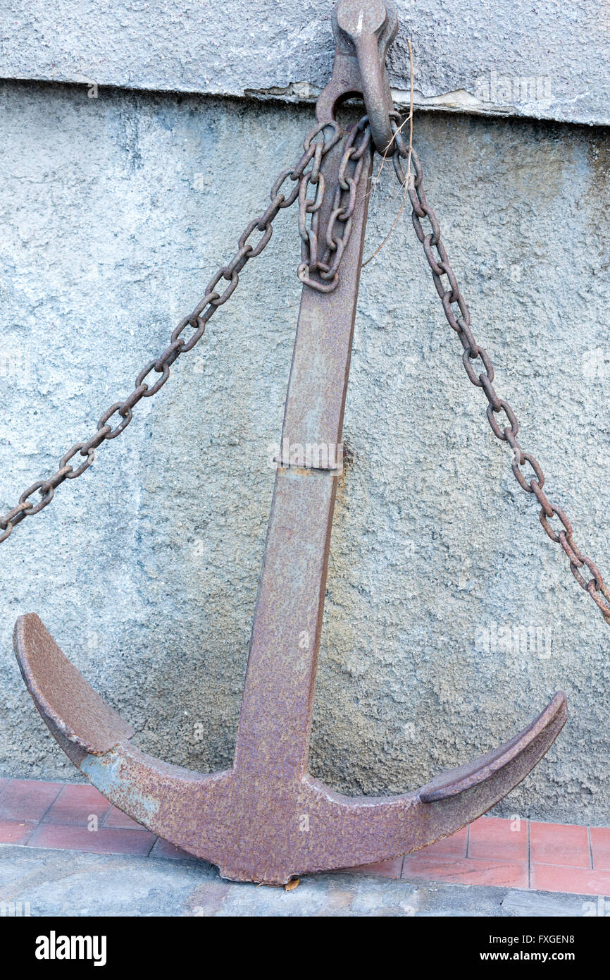 Anchor on a wall with chain Stock Photo - Alamy