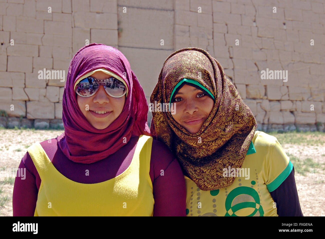 Two modern Egyption muslim girls wearing trendy modern hijabs in bright ...