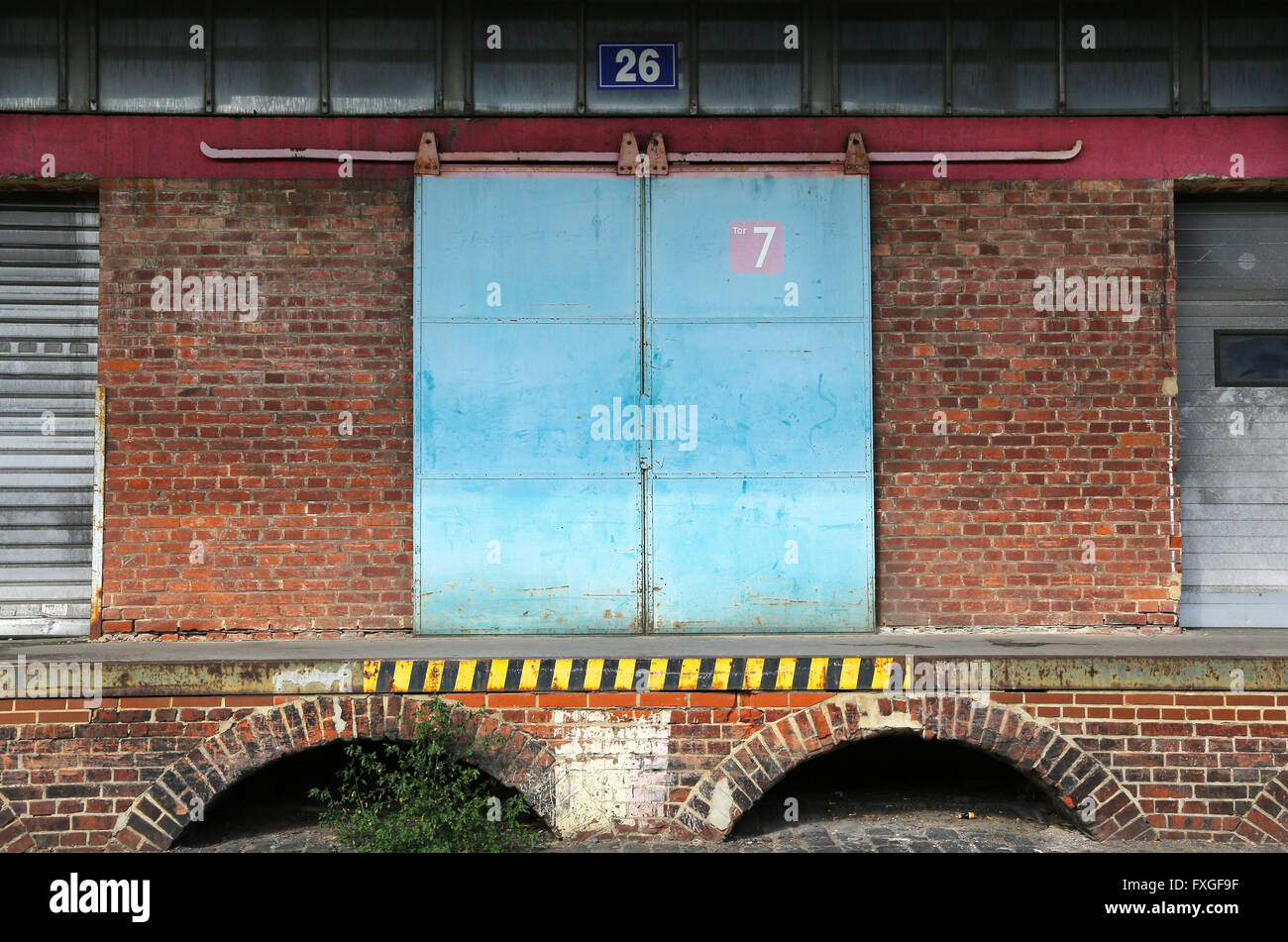 Exterior of old brick warehouse with loading dock Stock Photo - Alamy