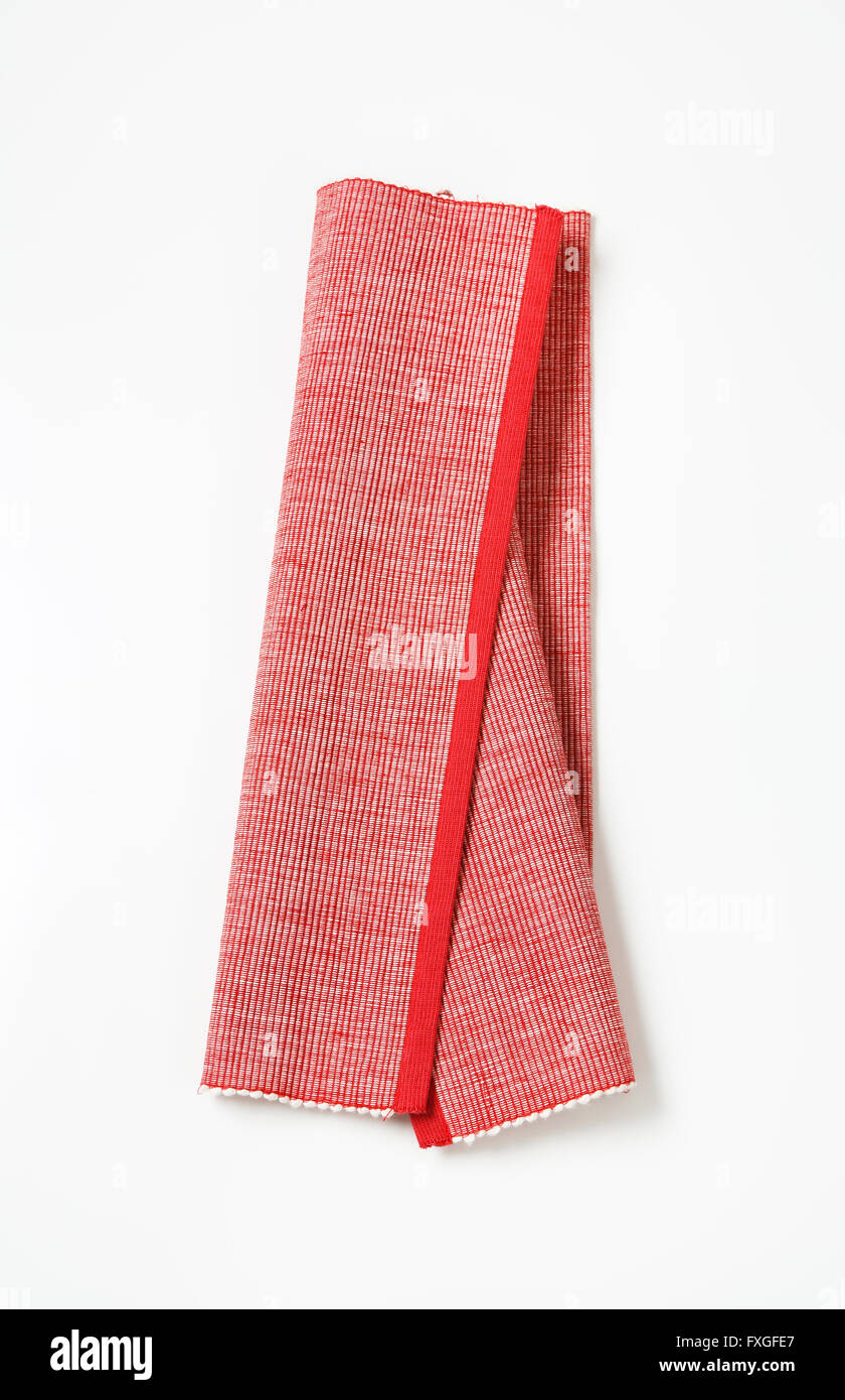 Folded red cloth place mat Stock Photo - Alamy