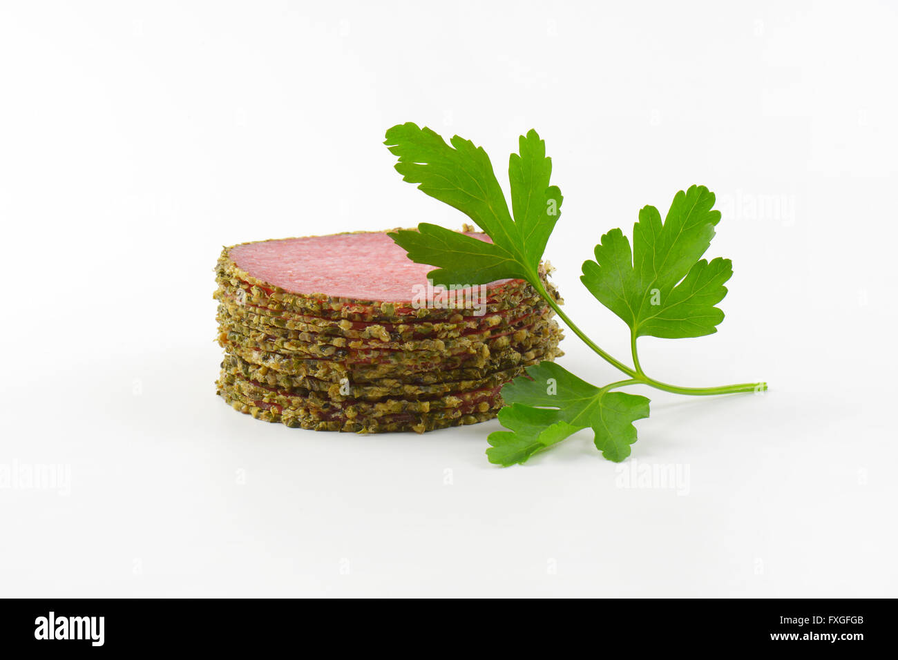 stack of sliced pepper salami on white background Stock Photo - Alamy