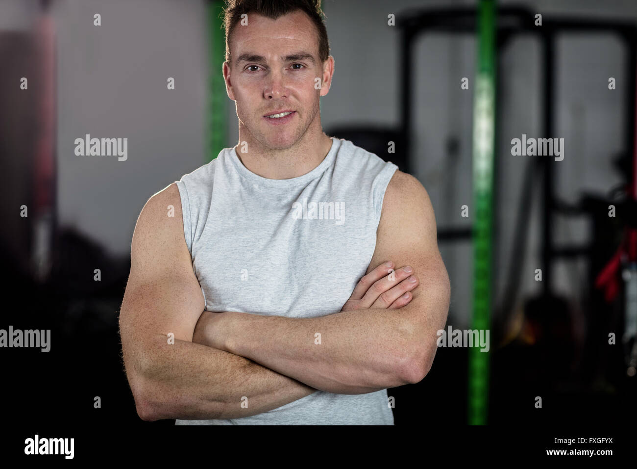 Man standing with arms crossed Stock Photo - Alamy