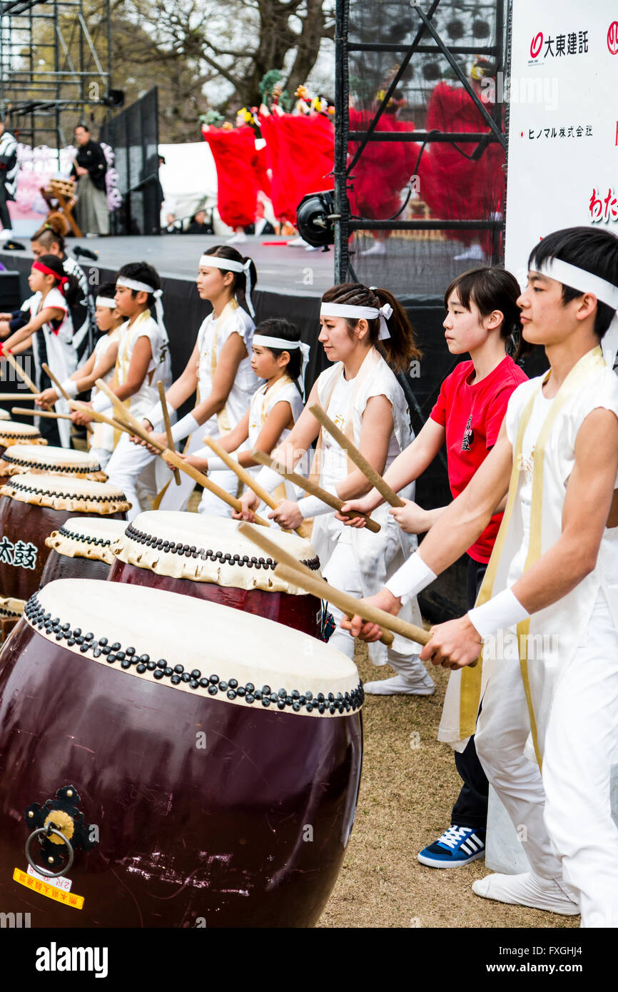 Taiko Drummers, kumi-daiko concert. Side view of row of children and ...