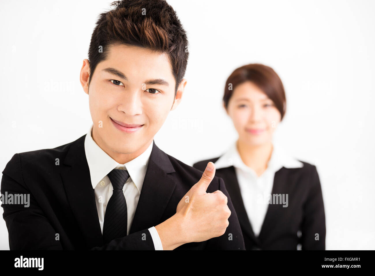 Happy business man with colleagues Stock Photo - Alamy