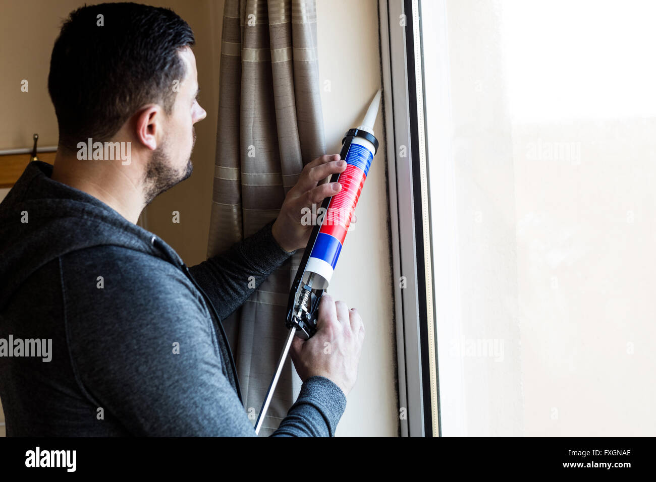 Man using pest control injection Stock Photo - Alamy